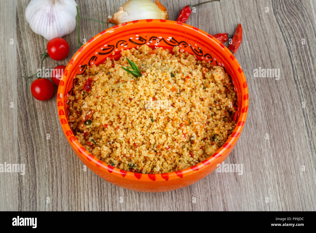 Arabic traditional cuisine - Couscous with tomato and green onion Stock ...