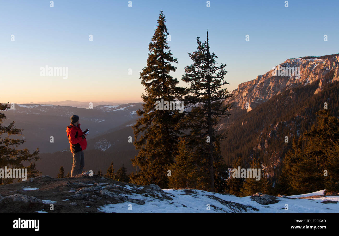 Winter landscape in the mountains with a red jacket tourist Stock Photo ...