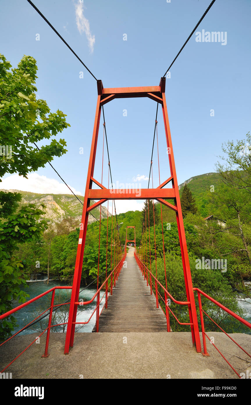 beautiful bridge in nature over wild river Stock Photo - Alamy