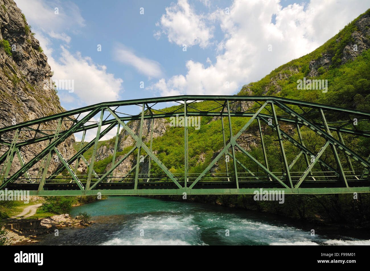 beautiful bridge in nature over wild river Stock Photo - Alamy