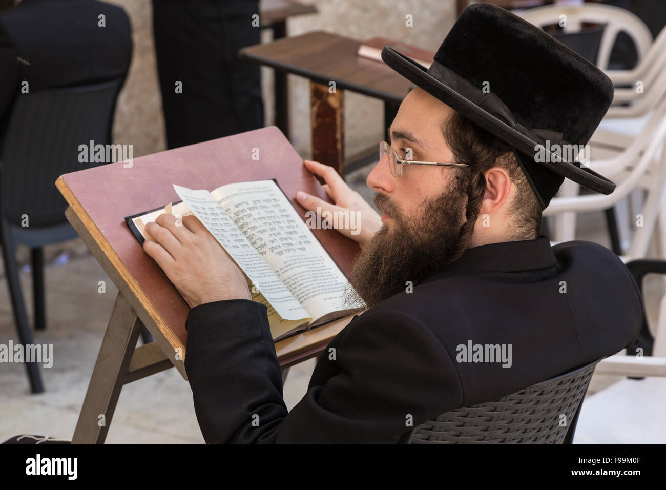 An Orthodox Jewish man praying at the Western Wall in Jerusalem, Israel ...