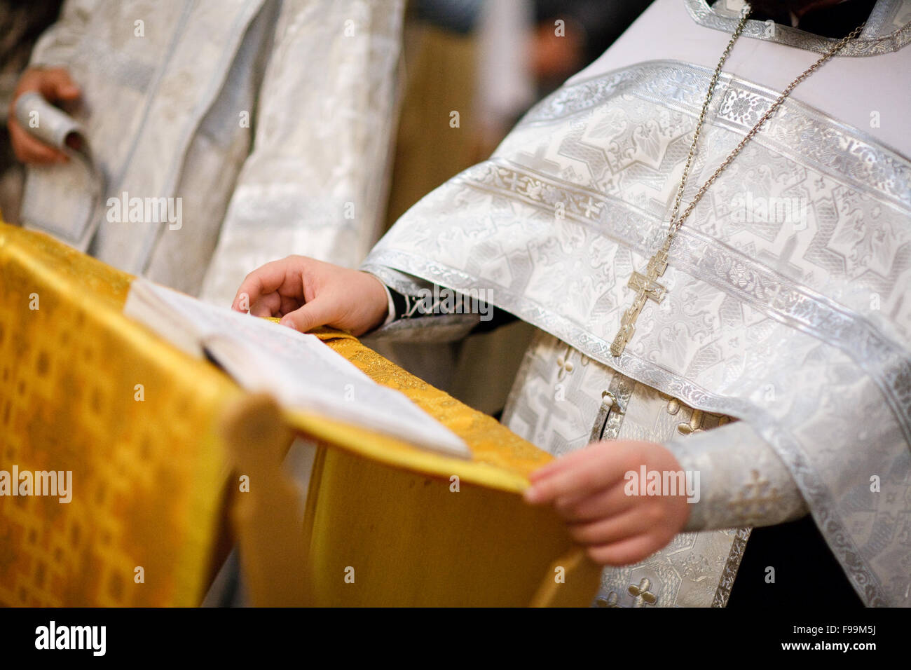 Church father reading bible hi-res stock photography and images - Alamy