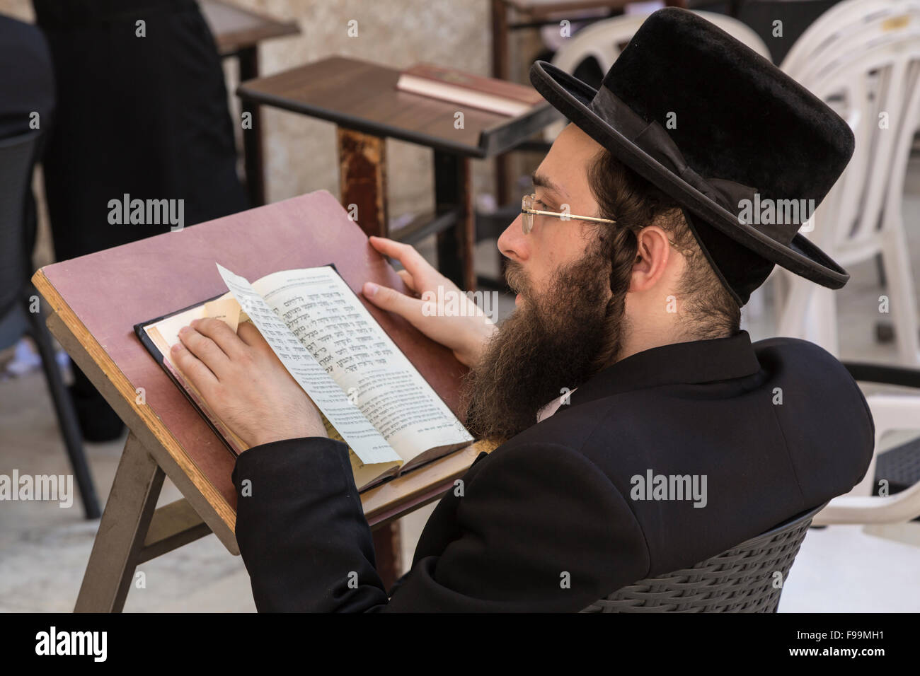 An Orthodox Jewish man praying at the Western Wall in Jerusalem, Israel ...