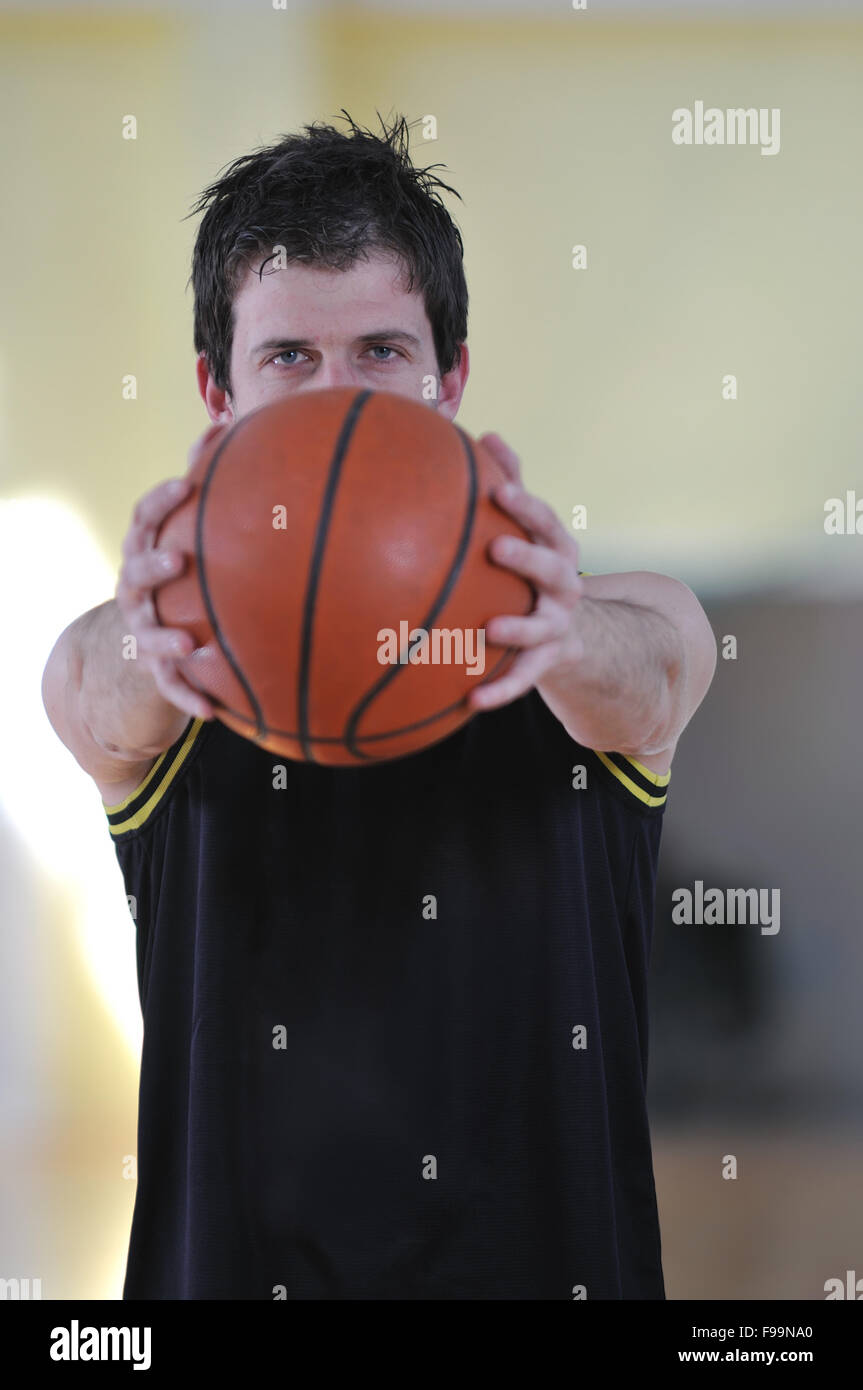 one healthy young man play basketball game in school gym indoor Stock ...