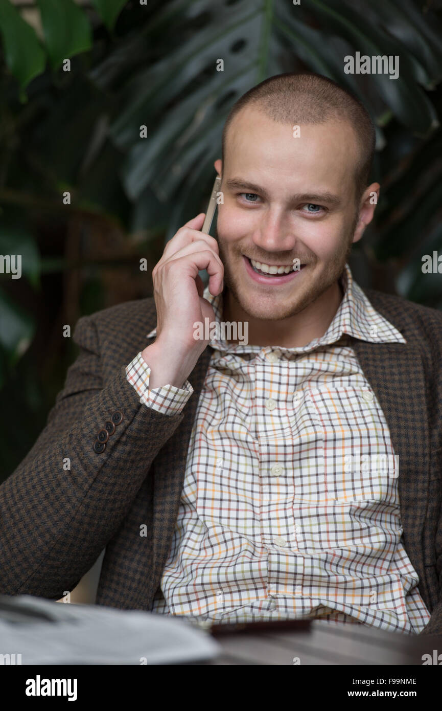 Young positive office male hi-res stock photography and images - Alamy