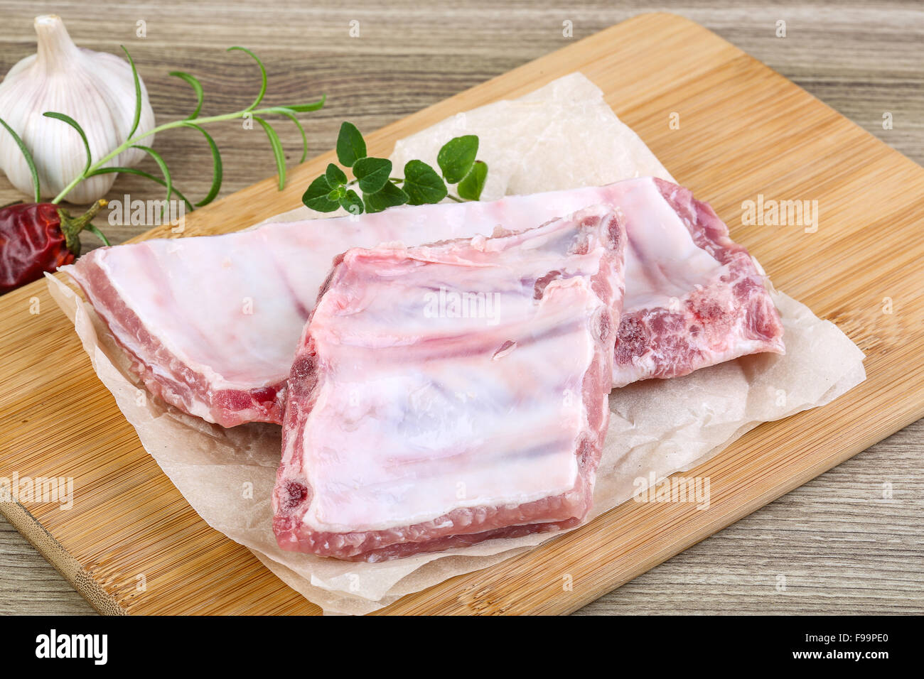 Raw pork ribs with herbs and spices ready for cooking Stock Photo - Alamy