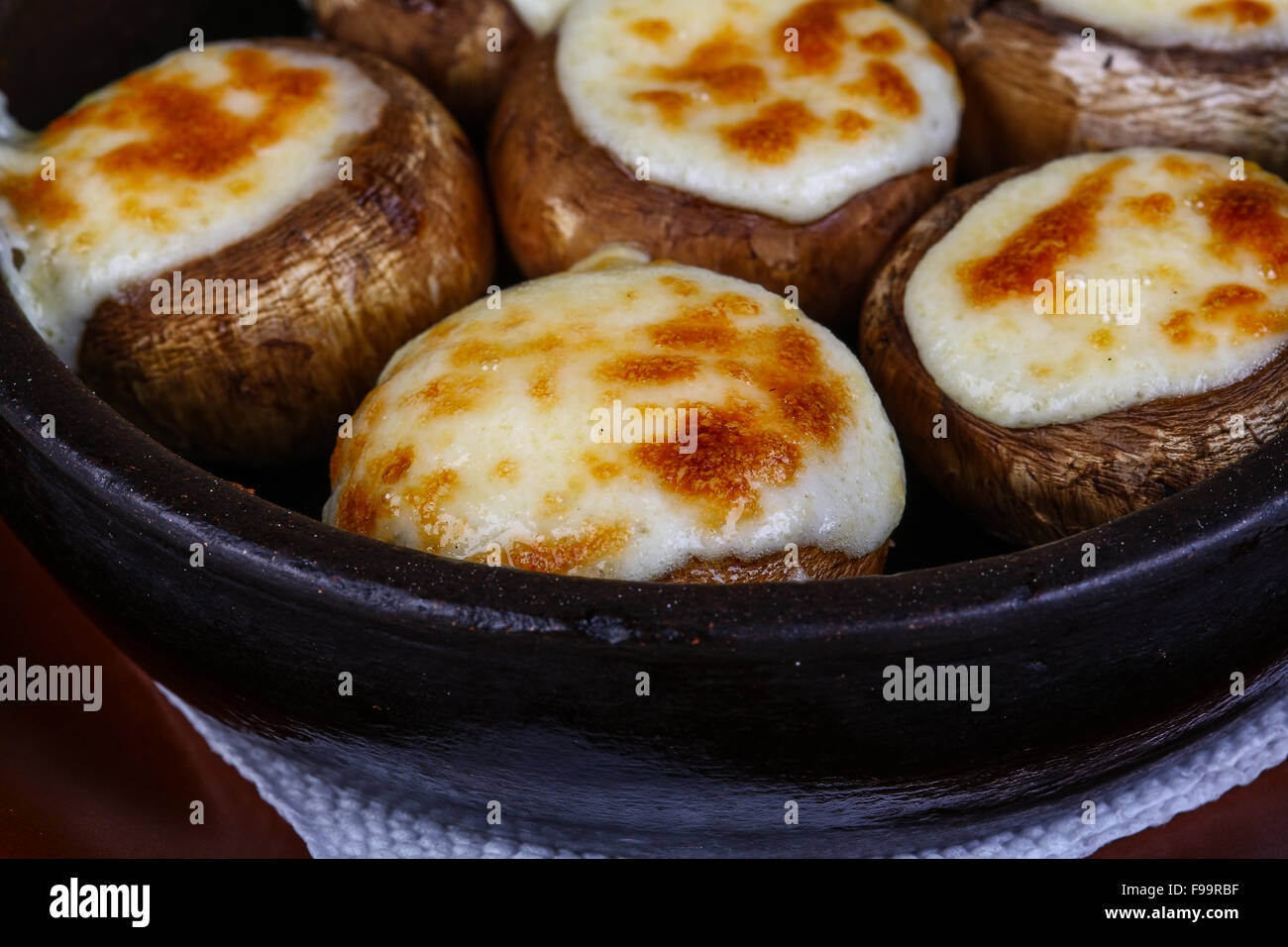 Baked Stuffed champignon with hard cheese and spices Stock Photo - Alamy