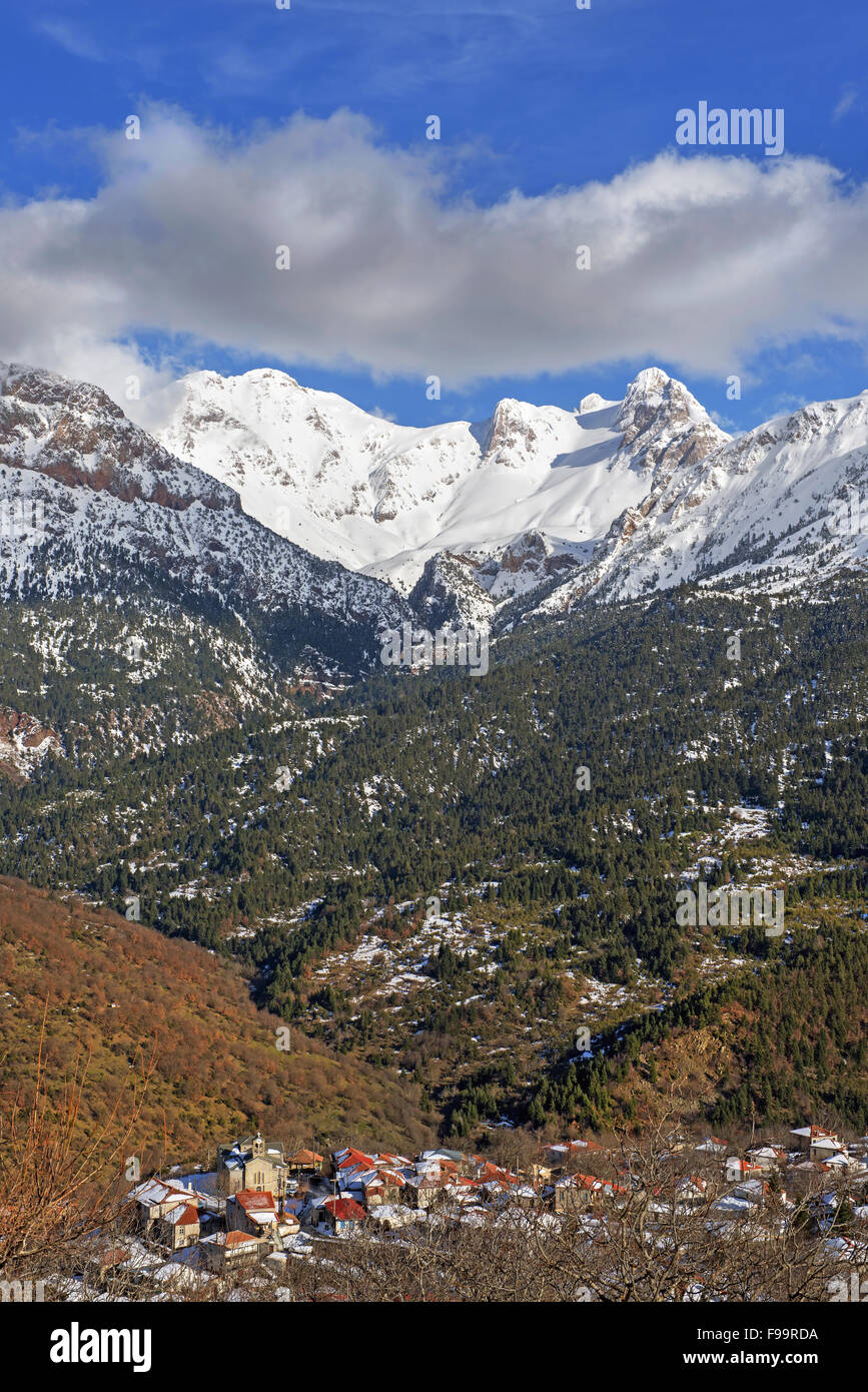 View of Artotina village at the foot of the snowy Vardousia mountain ...