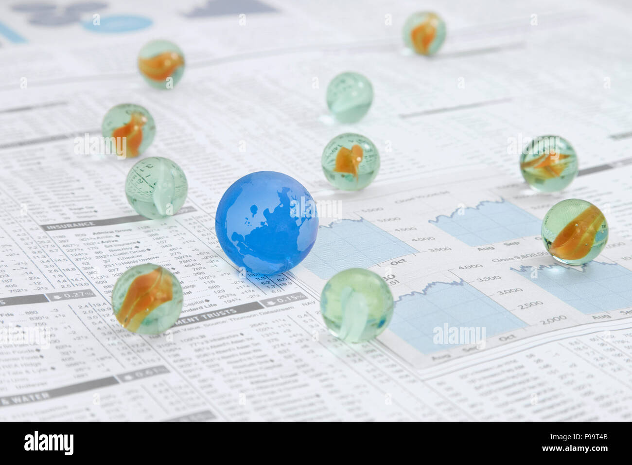 Group of marbles with a large Blue marble as the map of the Glob Stock ...