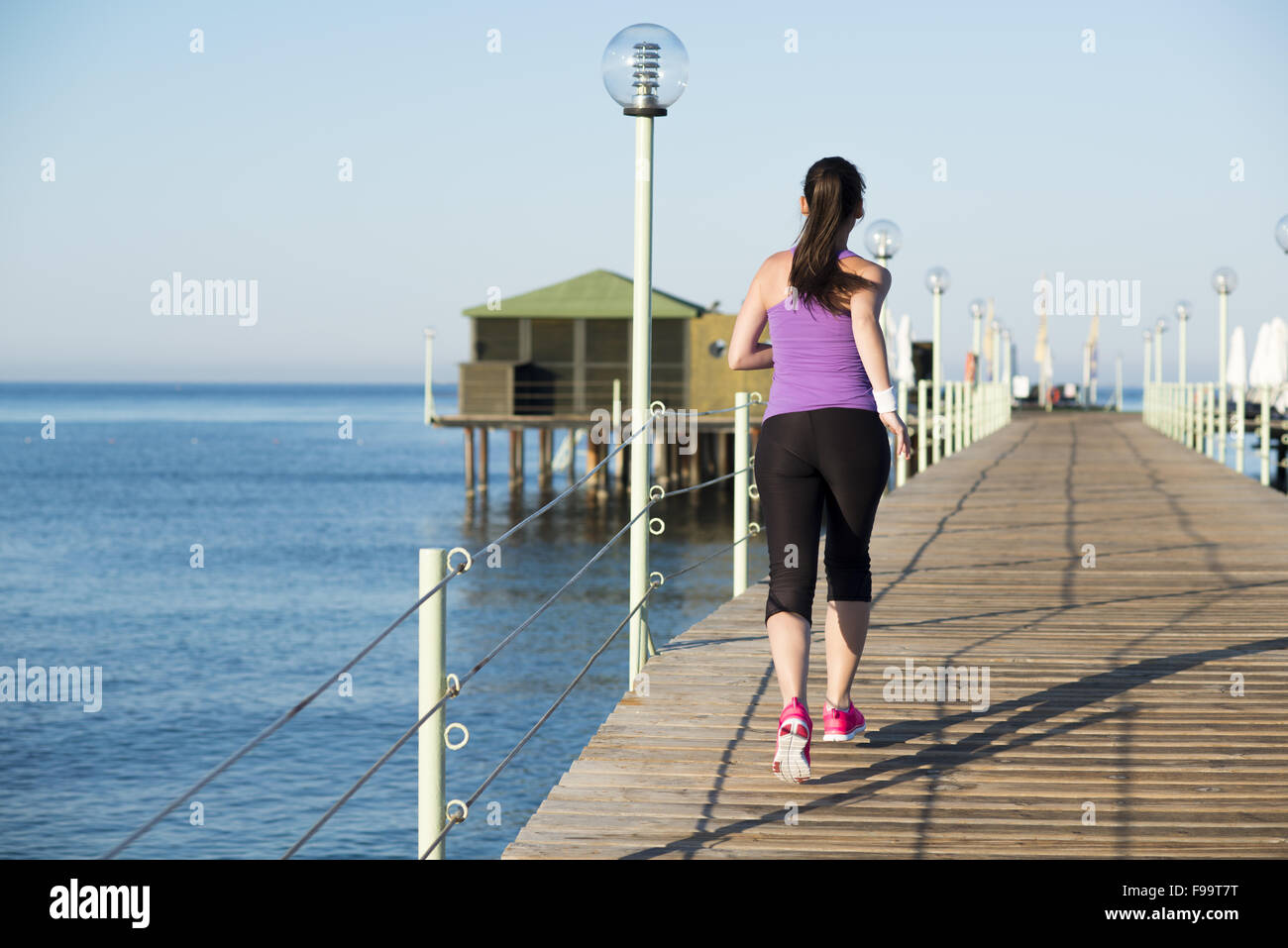 Female runner at sunset hi-res stock photography and images - Alamy