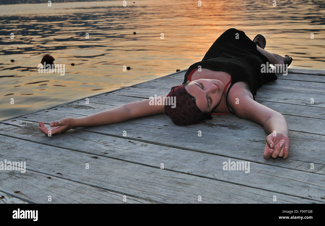 young happy woman with arms wide open representing freedom concept ...