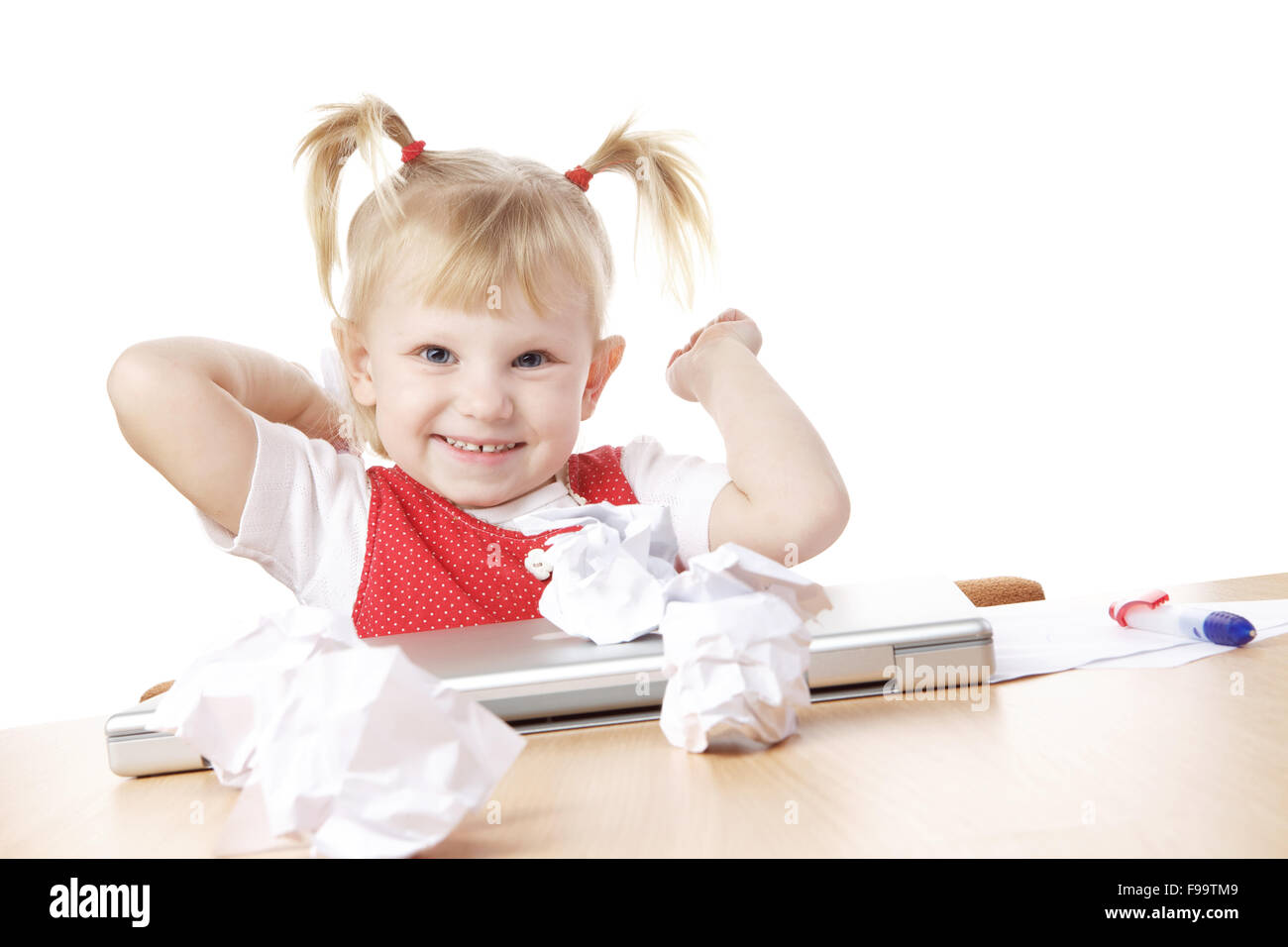 child throwing crampled sheets of paper Stock Photo - Alamy