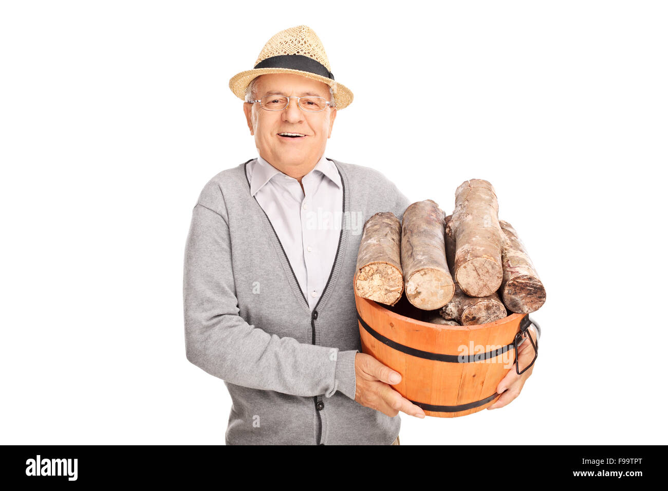 Senior man carrying firewood logs Stock Photo - Alamy