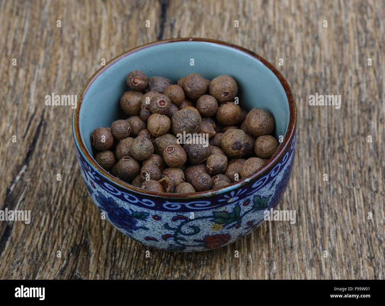 Fresh dry Aroma pepper corns on the wood background Stock Photo - Alamy