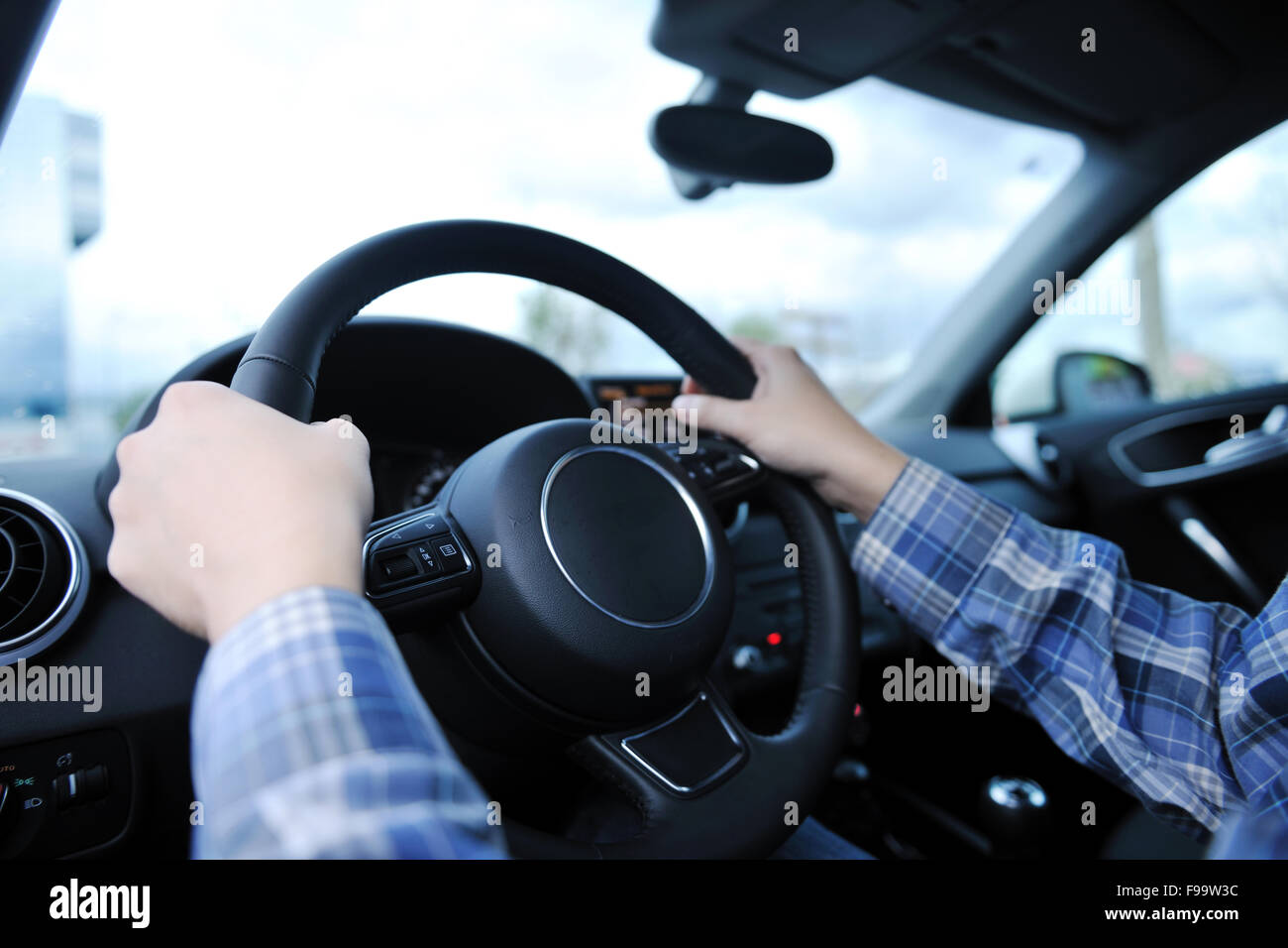 young man using new car navigation and onboard vehicle transport system ...