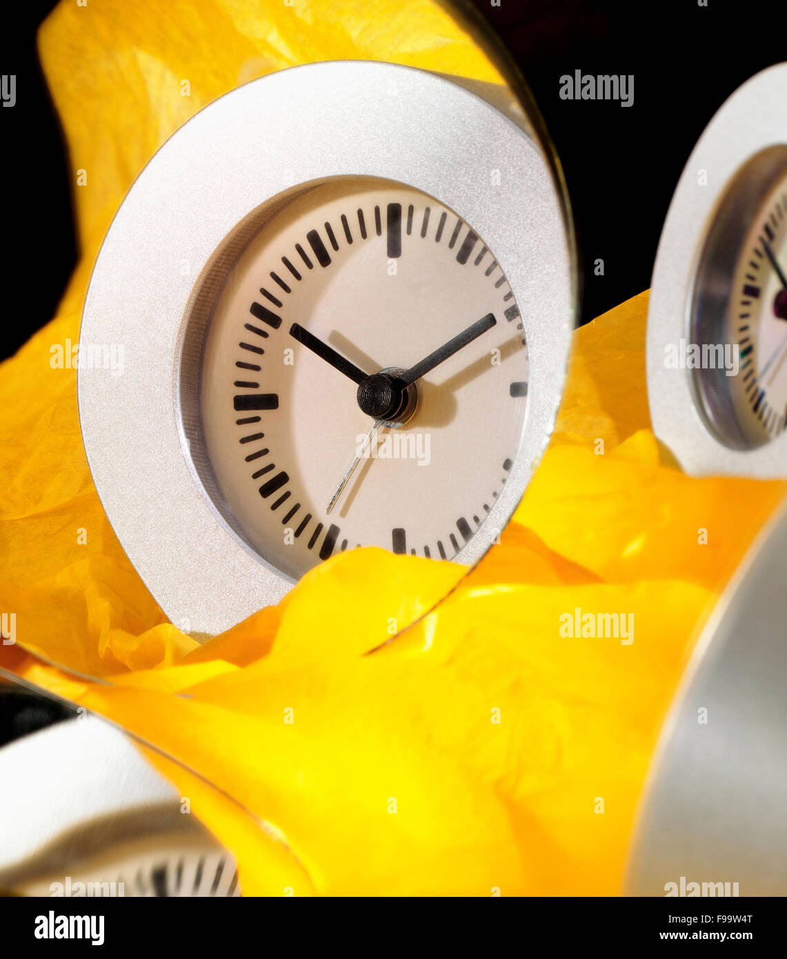 clock clean and simple wrapt in paper Stock Photo - Alamy