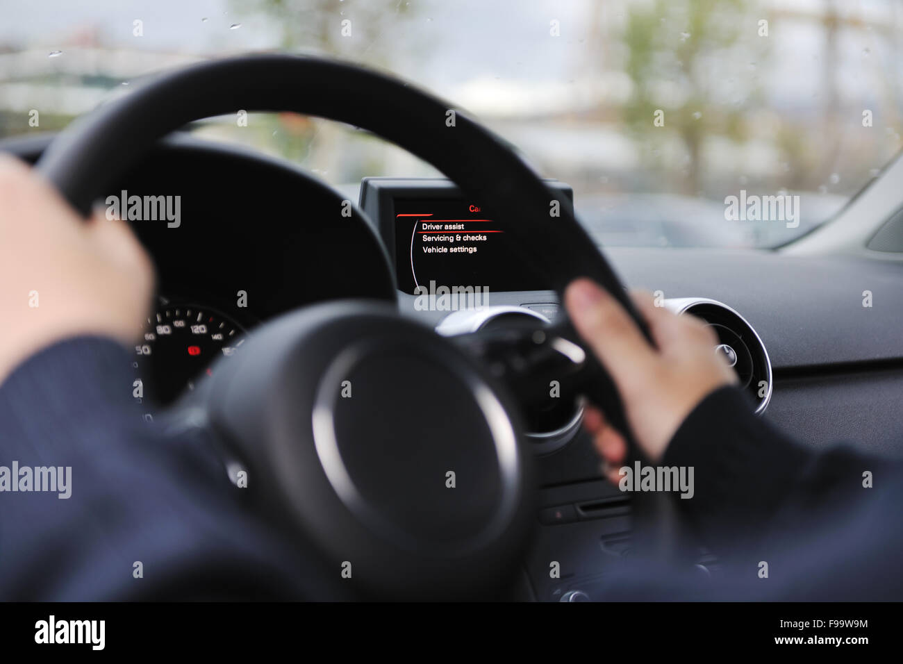 young man using new car navigation and onboard vehicle transport system ...