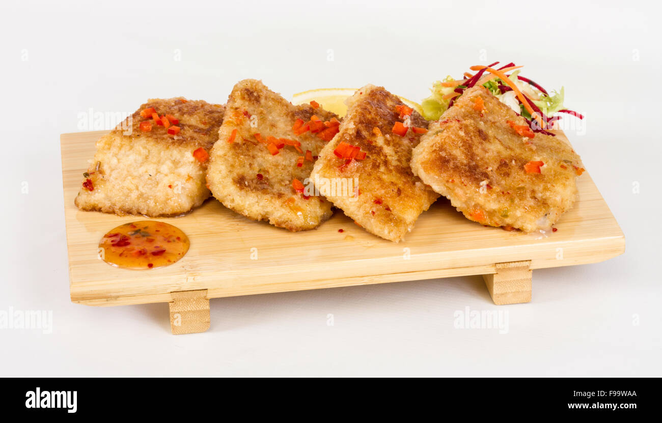 Fried fish fillets with salad Stock Photo - Alamy