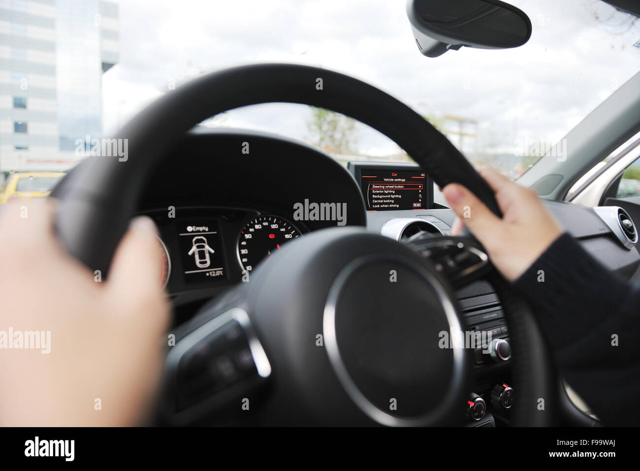 young man using new car navigation and onboard vehicle transport system ...