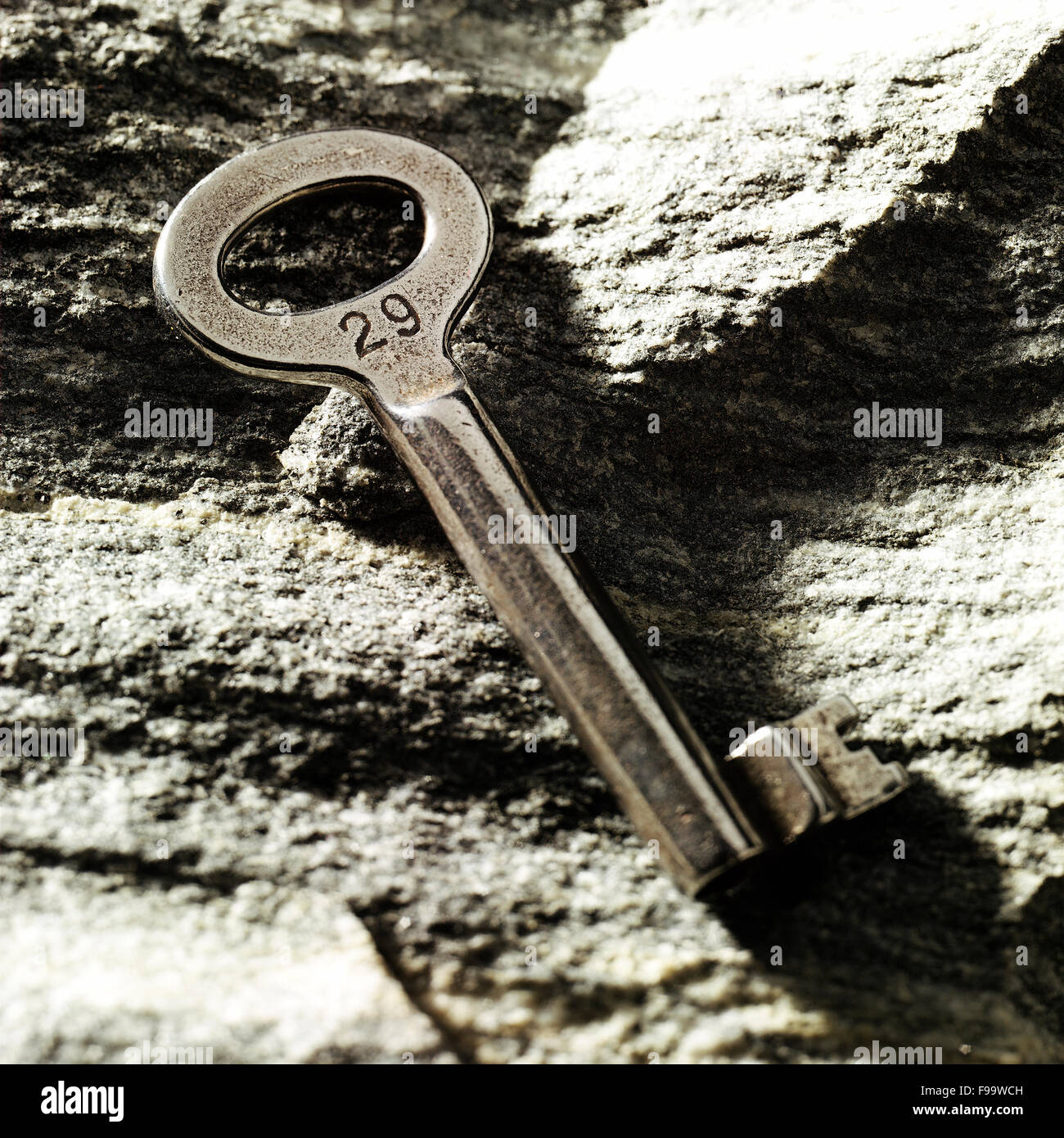old key on rough stone #2 Stock Photo - Alamy