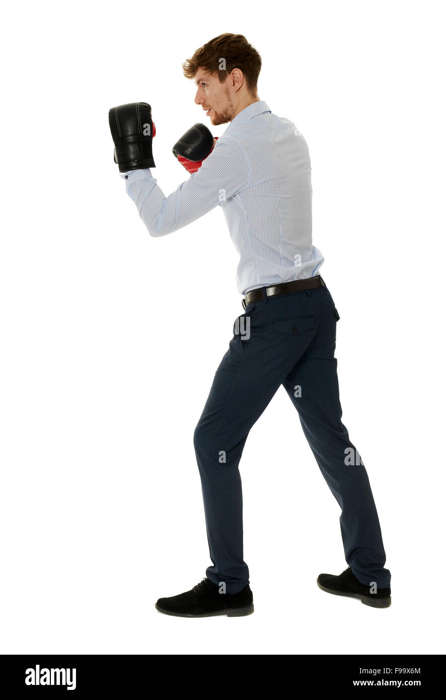 Young businessman fighter in a combat posture, ready to take on any ...