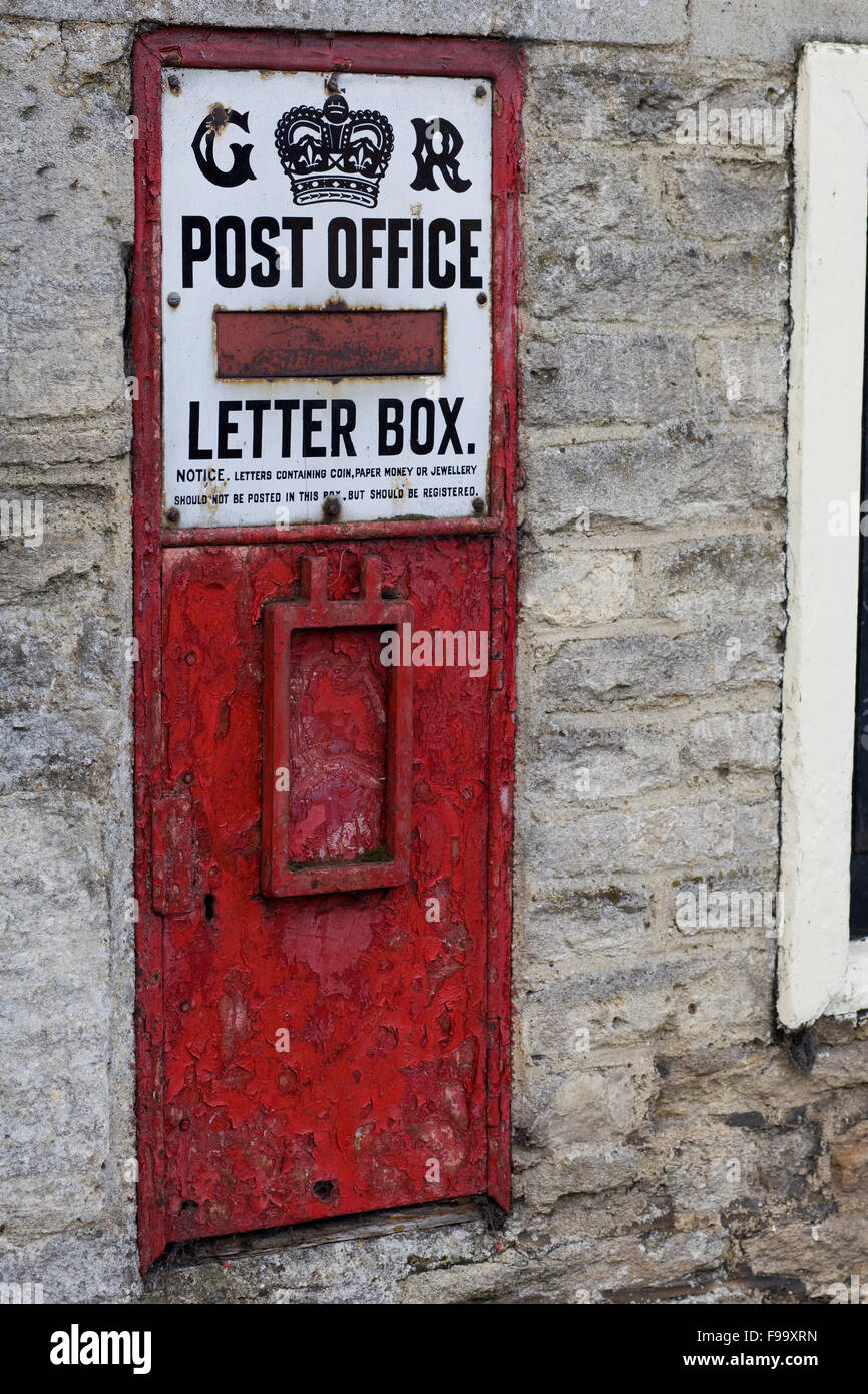 Very old postbox in a stone wall Stock Photo - Alamy