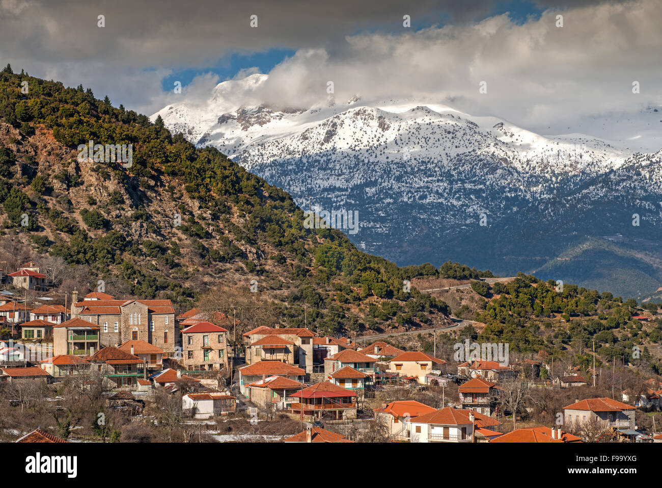 View of Pentagioi village at the foot of the snowy Vardousia mountain ...