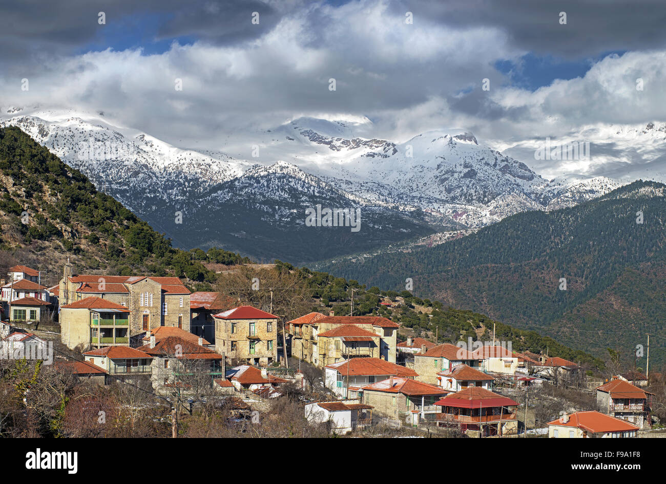 View of Pentagioi village at the foot of the snowy Vardousia mountain ...