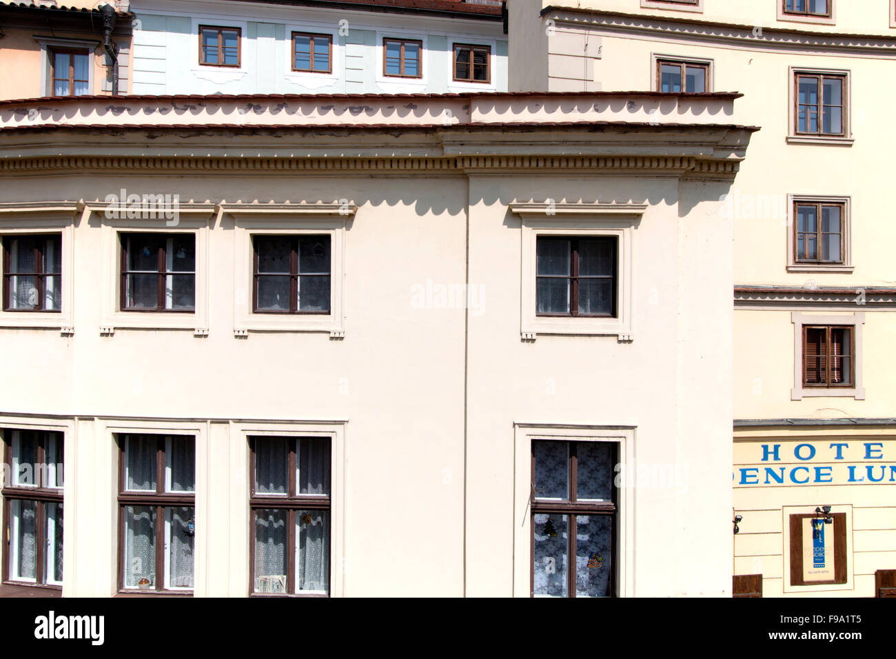 Main cream building with lots of windows and buildings behind Stock ...