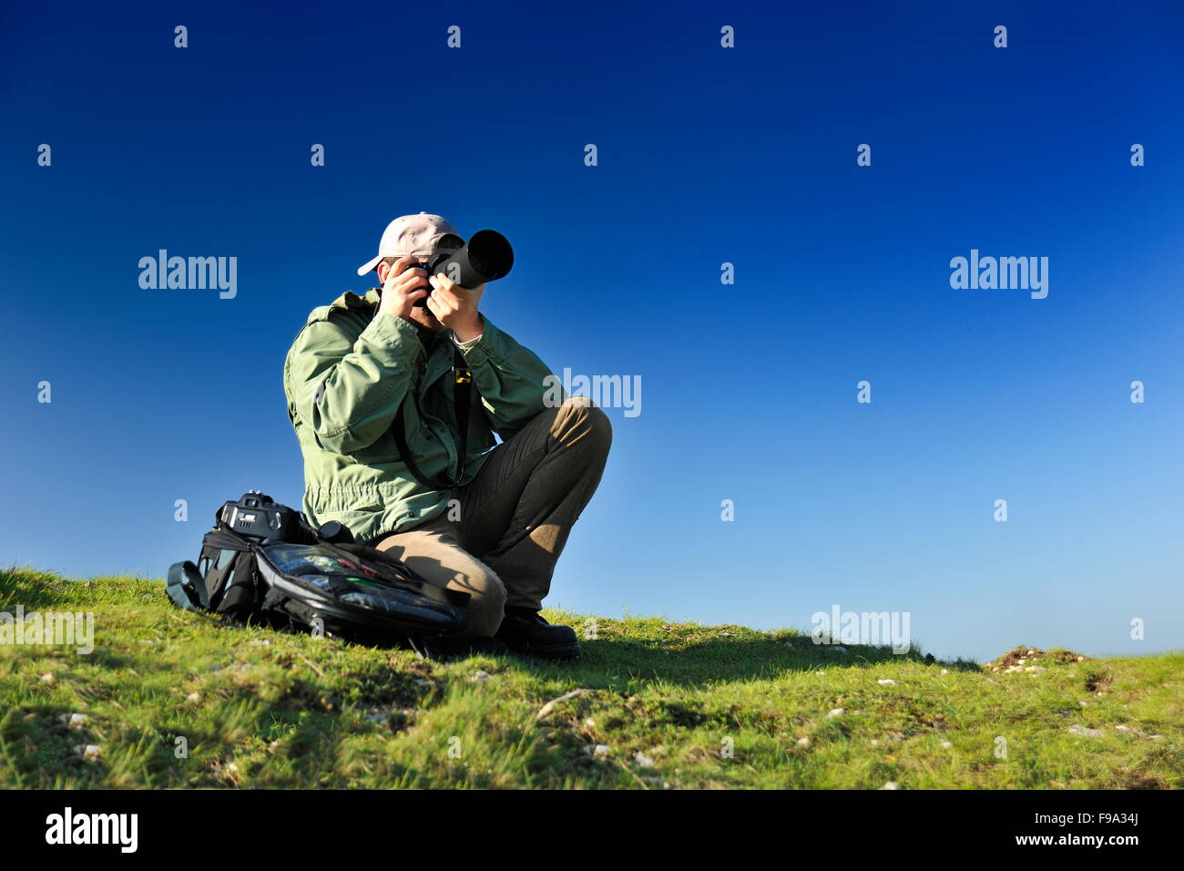 Nature photographer with digital camera on top of the mountain Stock ...