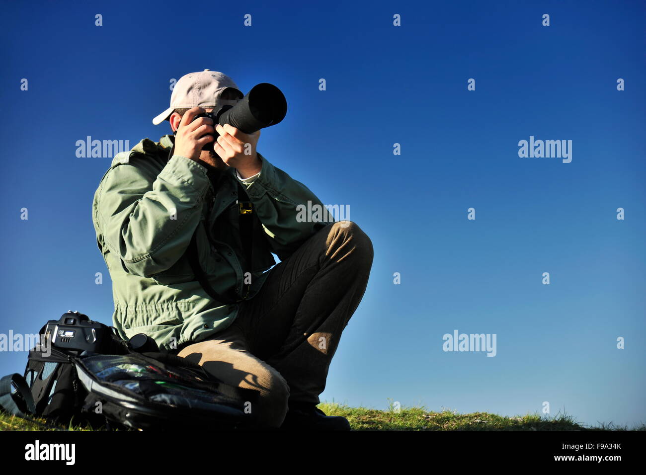 Nature photographer with digital camera on top of the mountain Stock ...