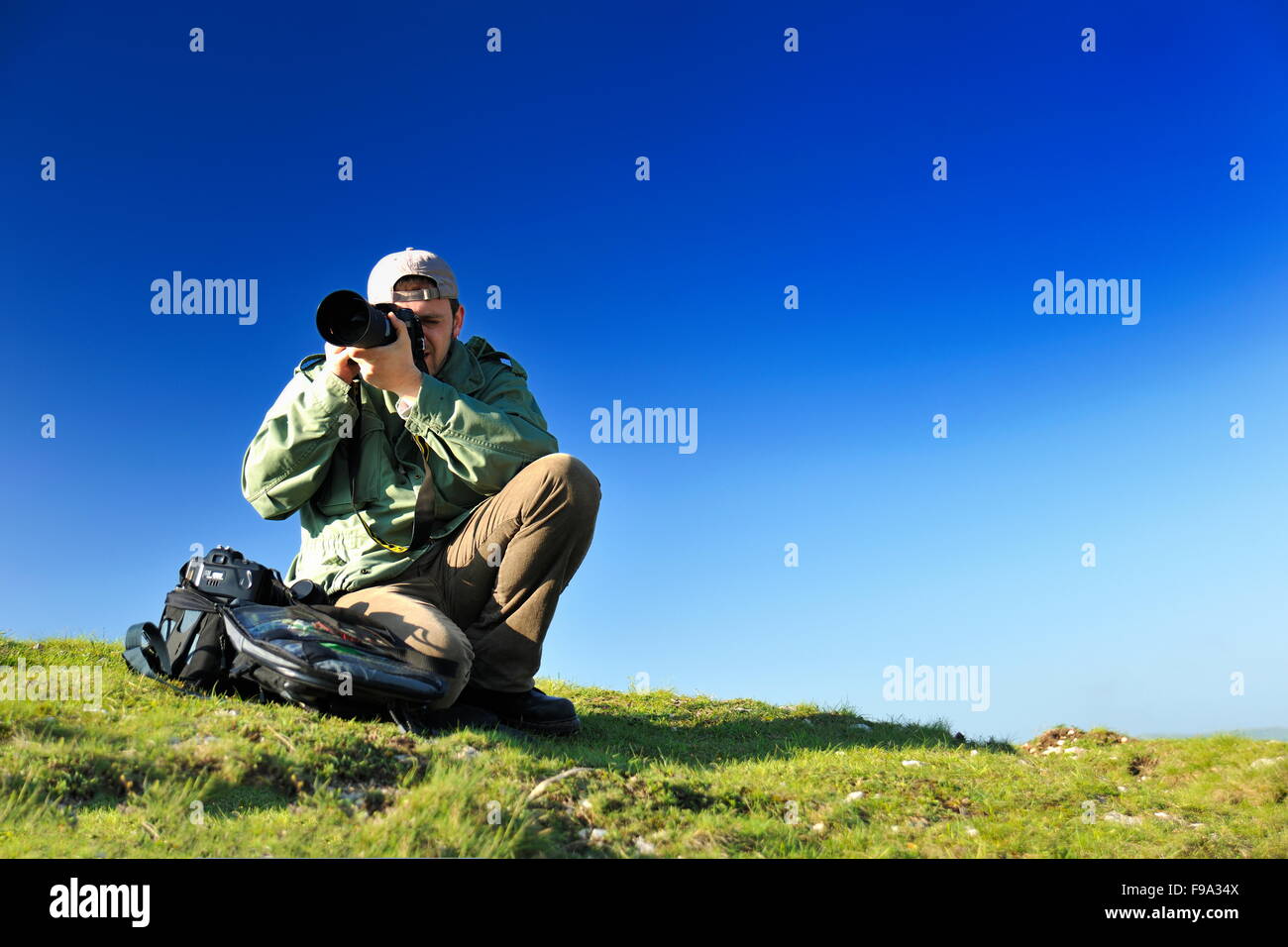 Nature photographer with digital camera on top of the mountain Stock ...
