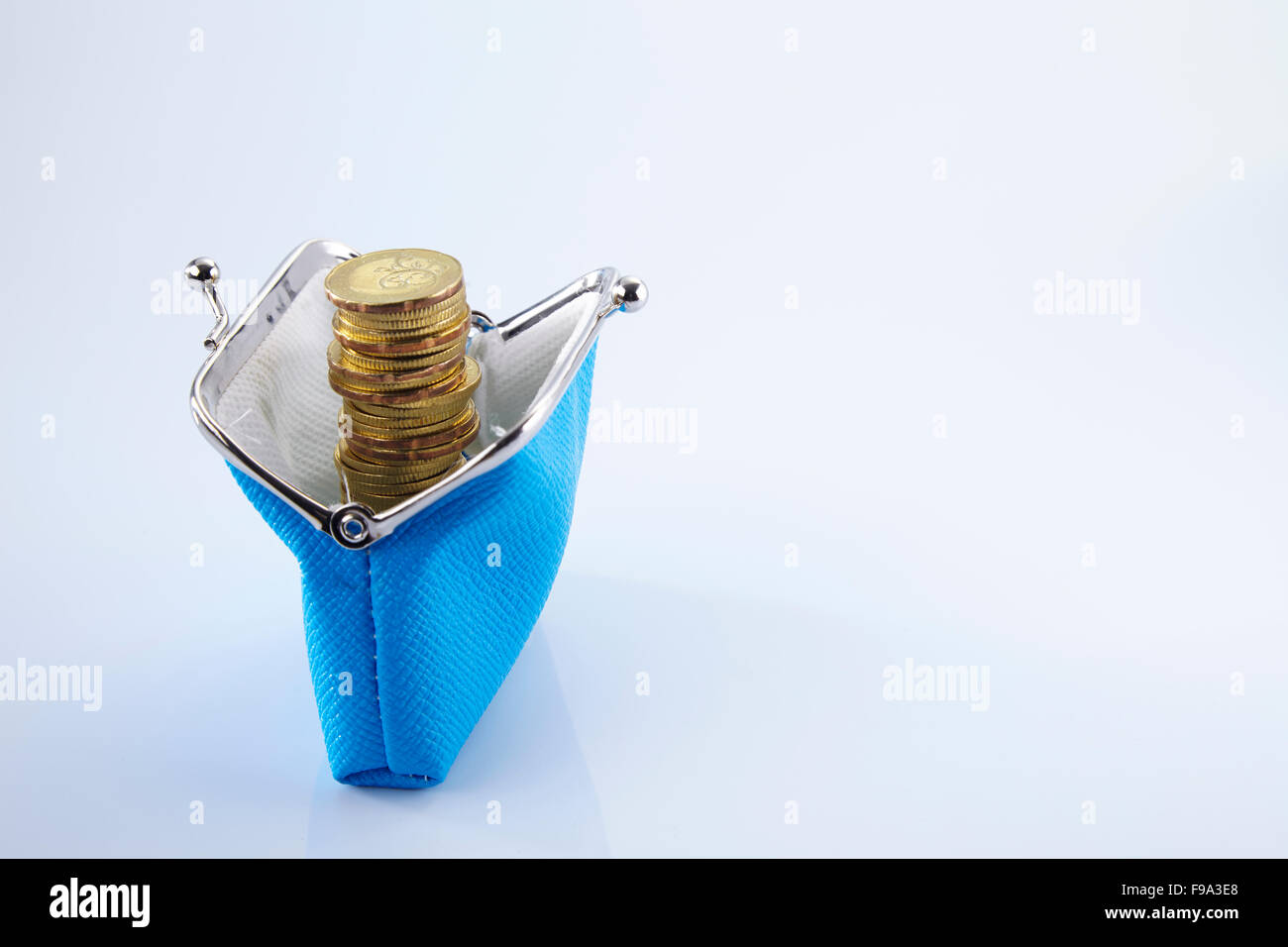 coins in the blue color purse Stock Photo - Alamy