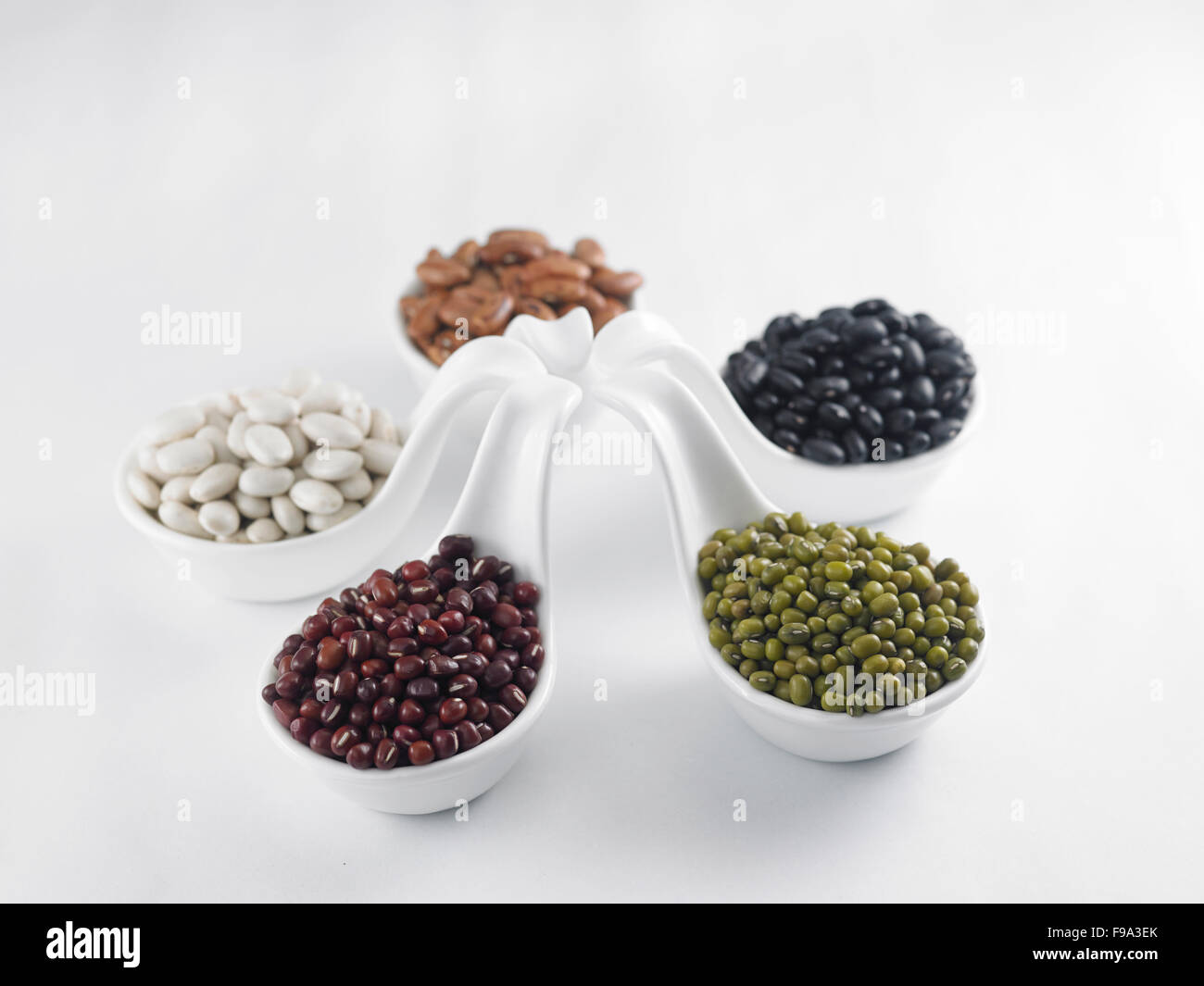 five organic soup bean on the white background Stock Photo - Alamy