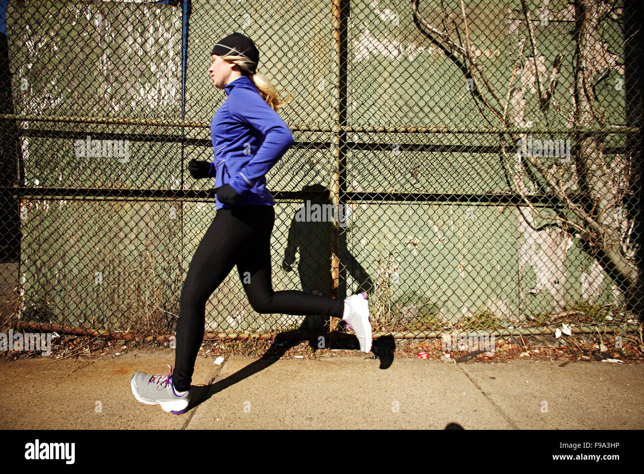 A woman running Stock Photo - Alamy