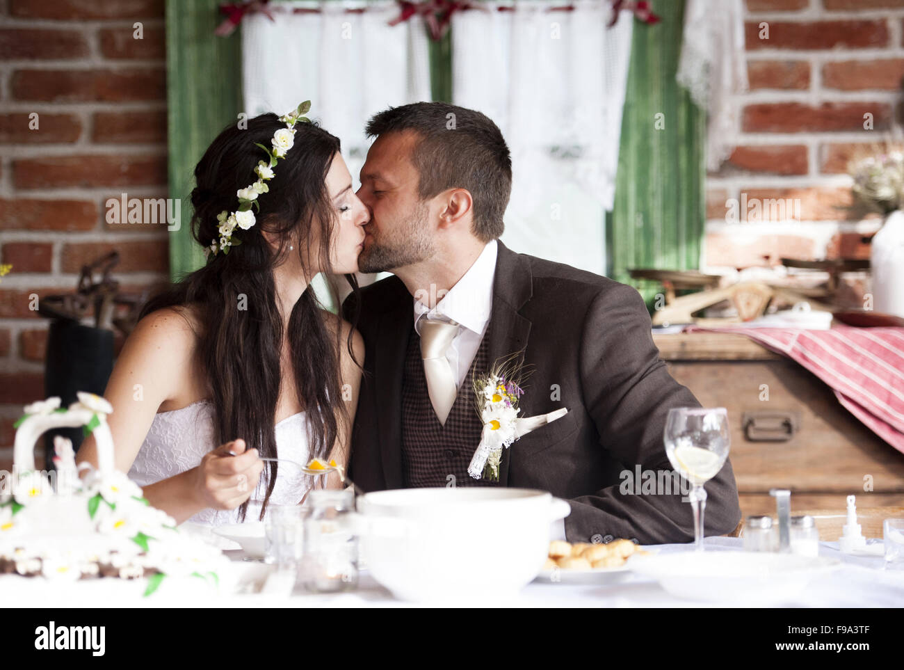 Bride and groom are eating at the wedding reception Stock Photo - Alamy