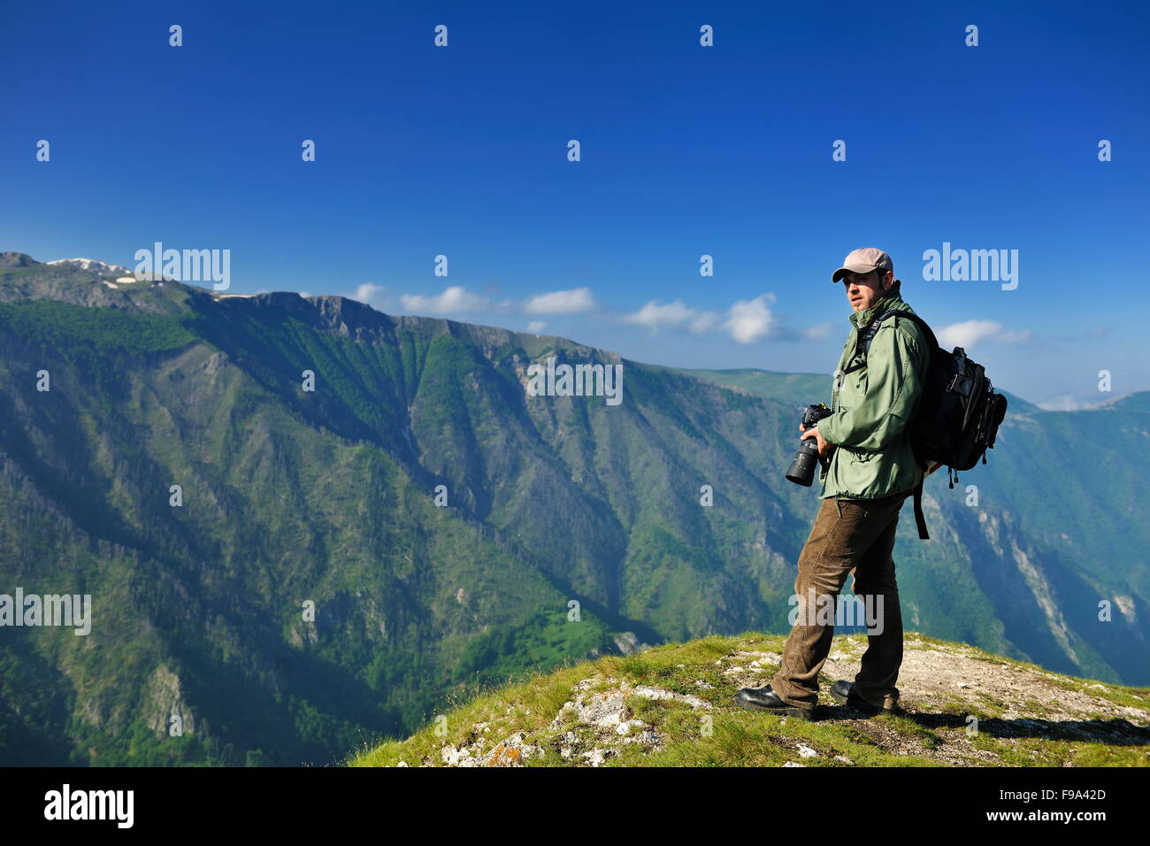 Nature photographer with digital camera on top of the mountain Stock ...