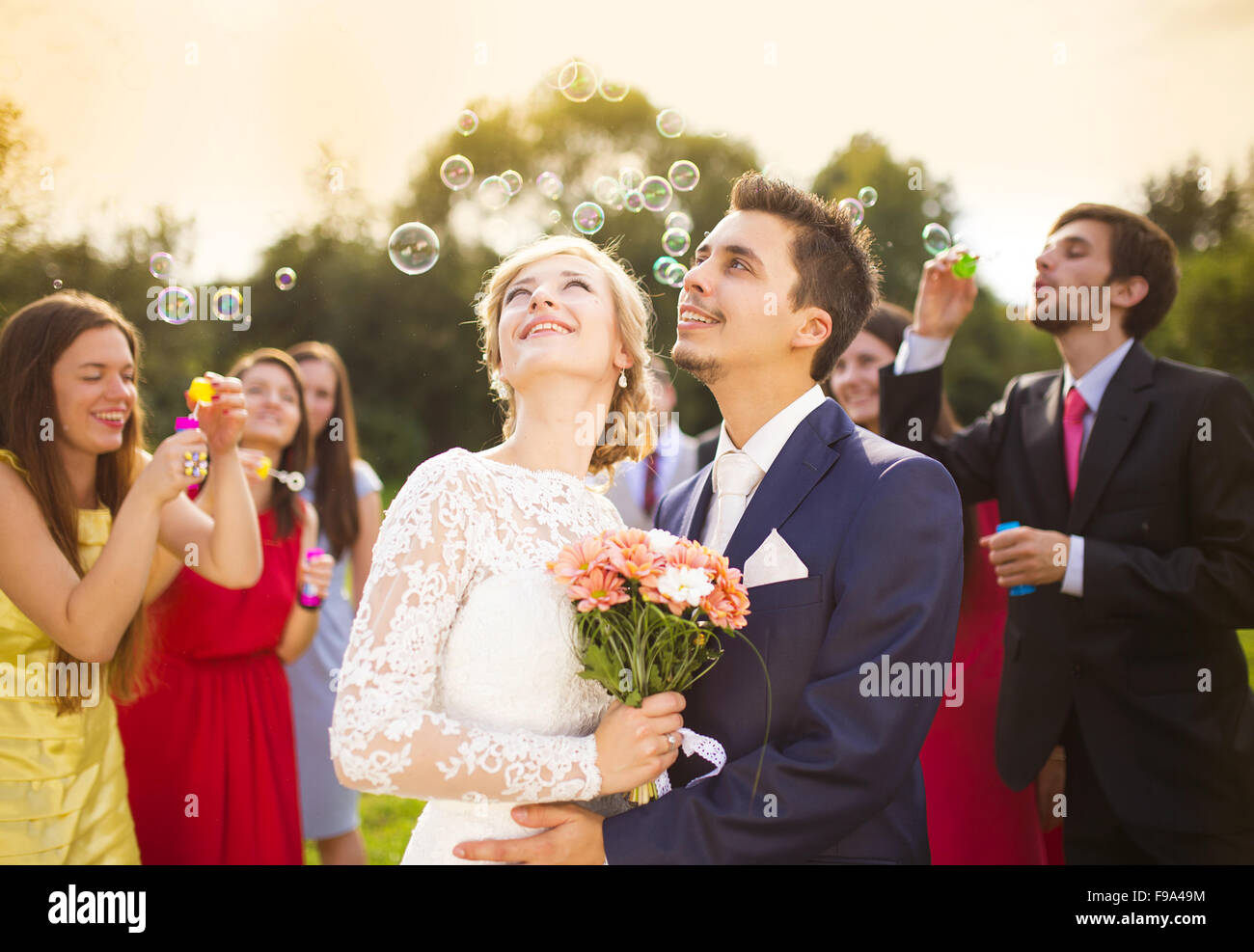 Young newlyweds enjoying romantic moment together at wedding reception ...