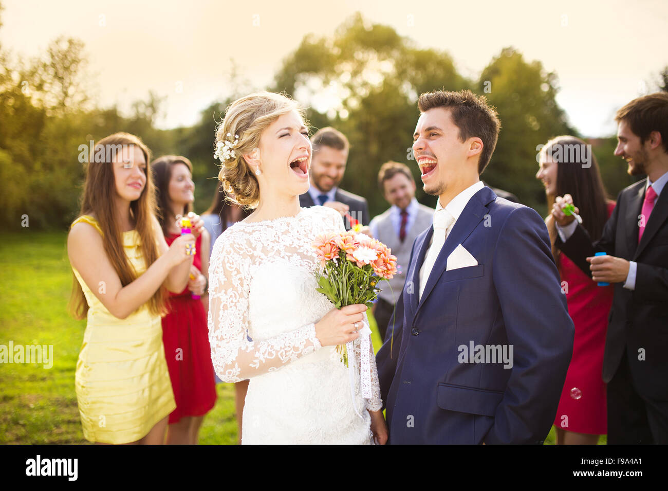 Young newlyweds enjoying romantic moment together at wedding reception ...