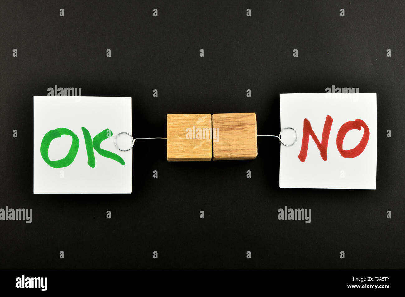 Approval ok and no, two white paper notes with wooden holders in ...