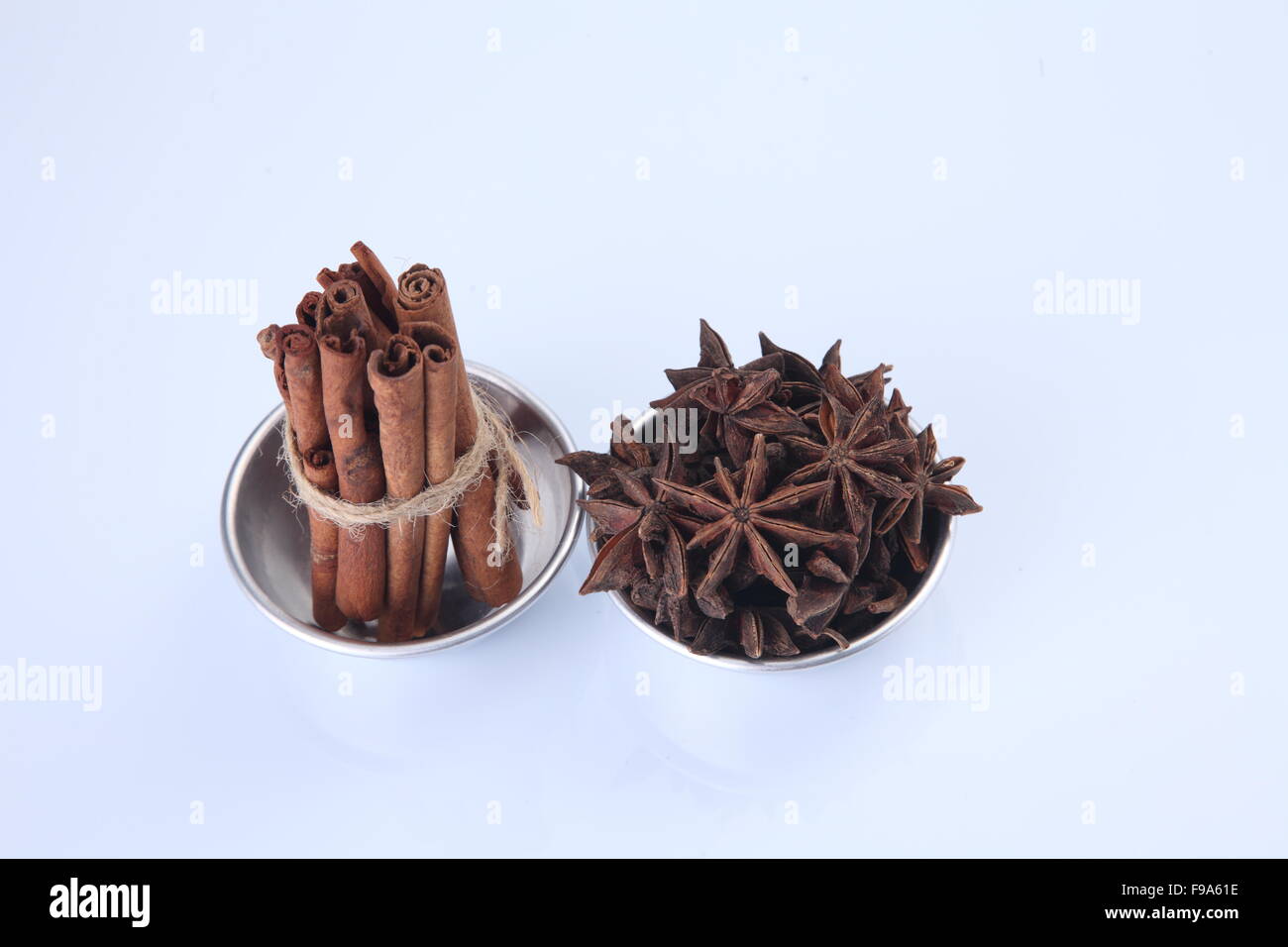 cinnamon stick and anise star in a container Stock Photo - Alamy