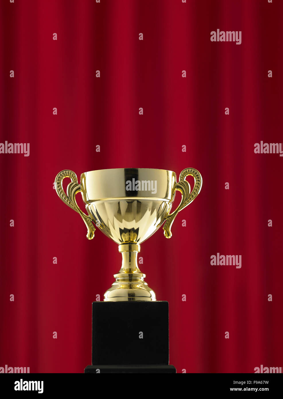 trophy in front of the red curtain Stock Photo - Alamy