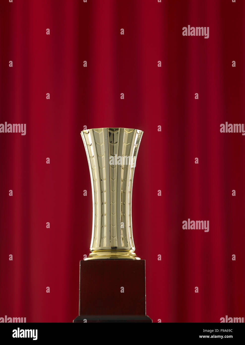 trophy in front of the red curtain Stock Photo - Alamy