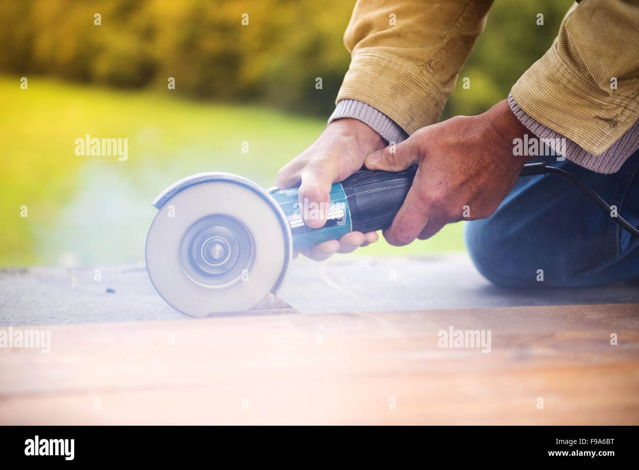 Detail of carpenters hand grinding wooden planks Stock Photo - Alamy
