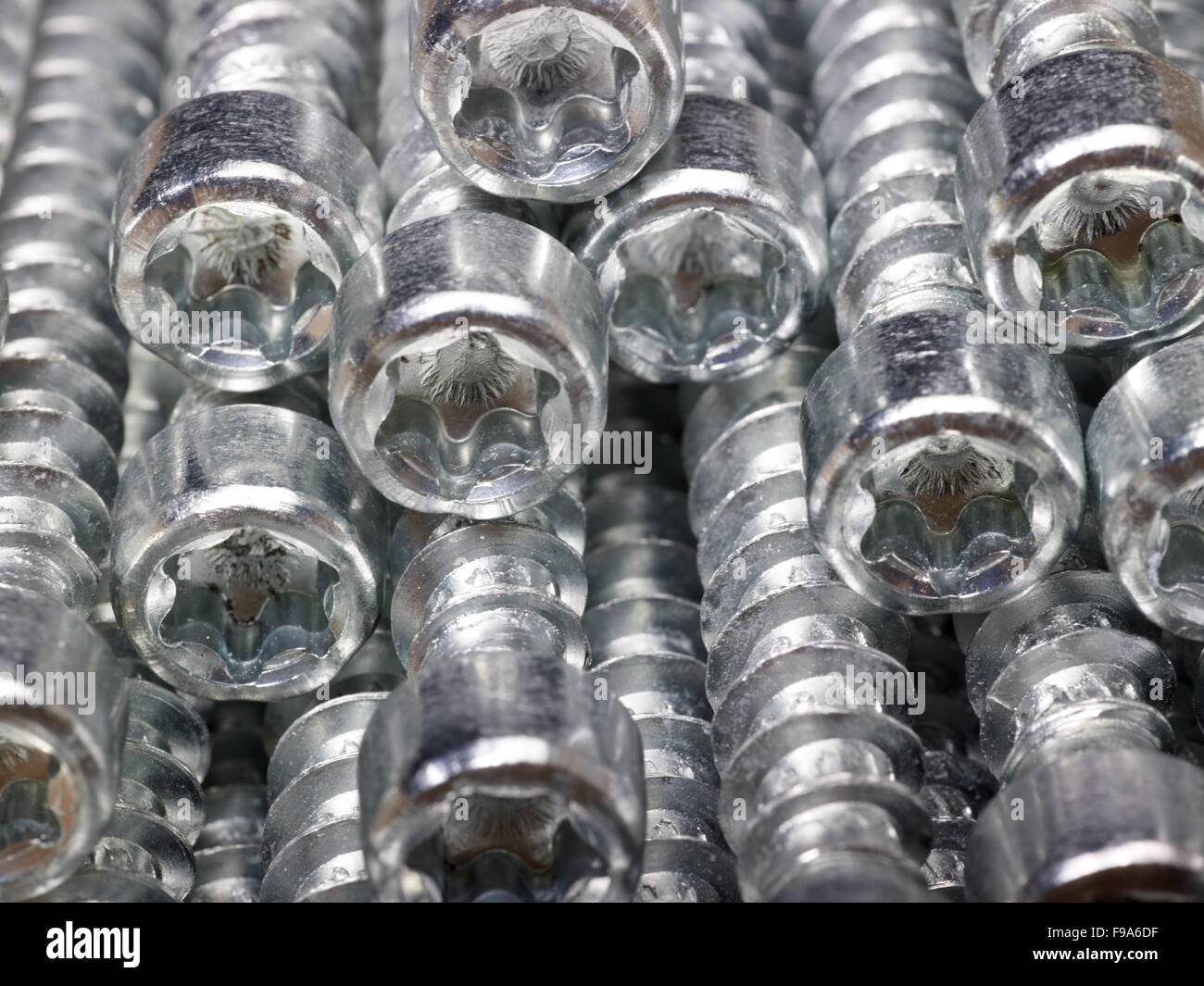 full frame background showing lots of long screws Stock Photo - Alamy