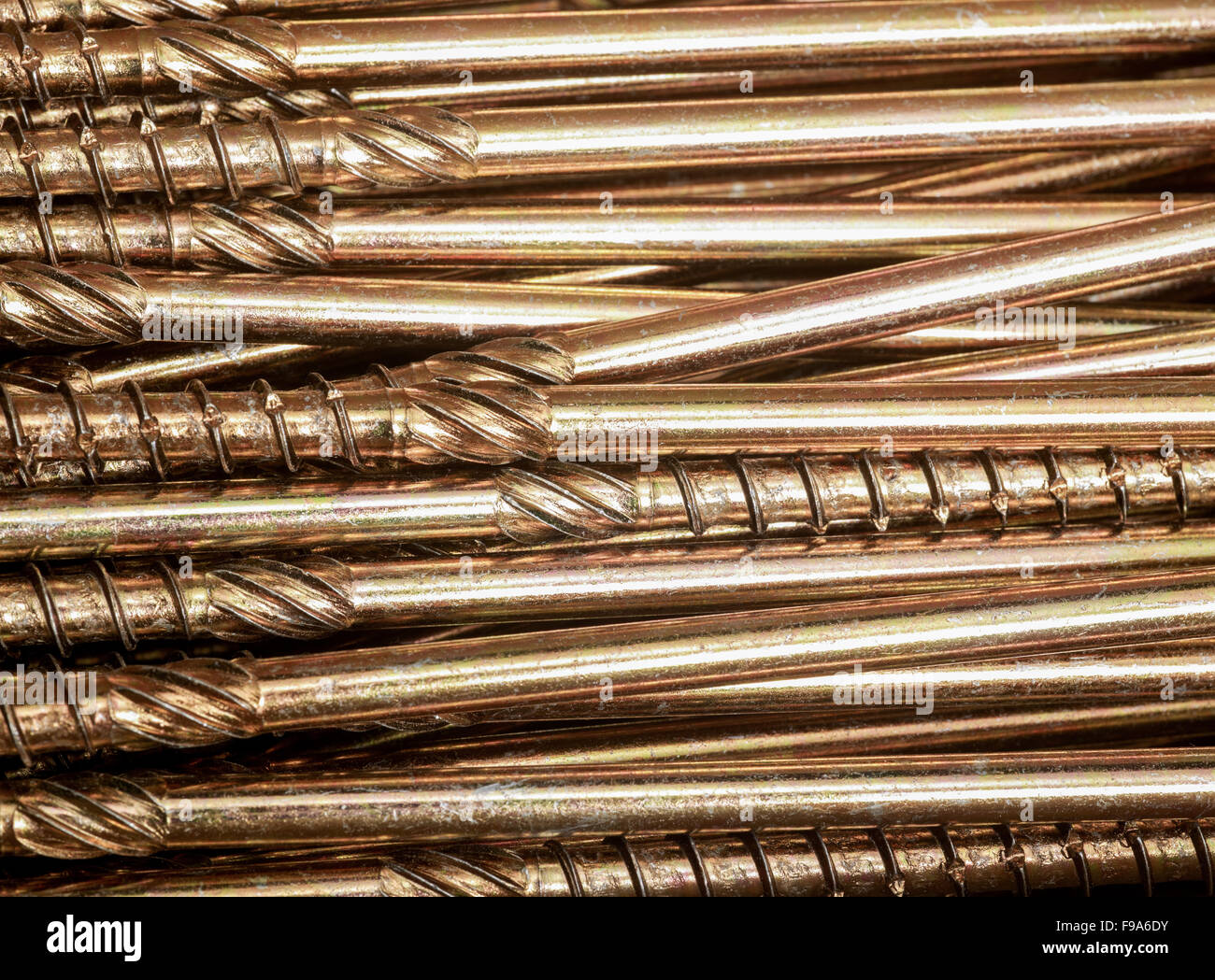 full frame background showing lots of long screws Stock Photo - Alamy