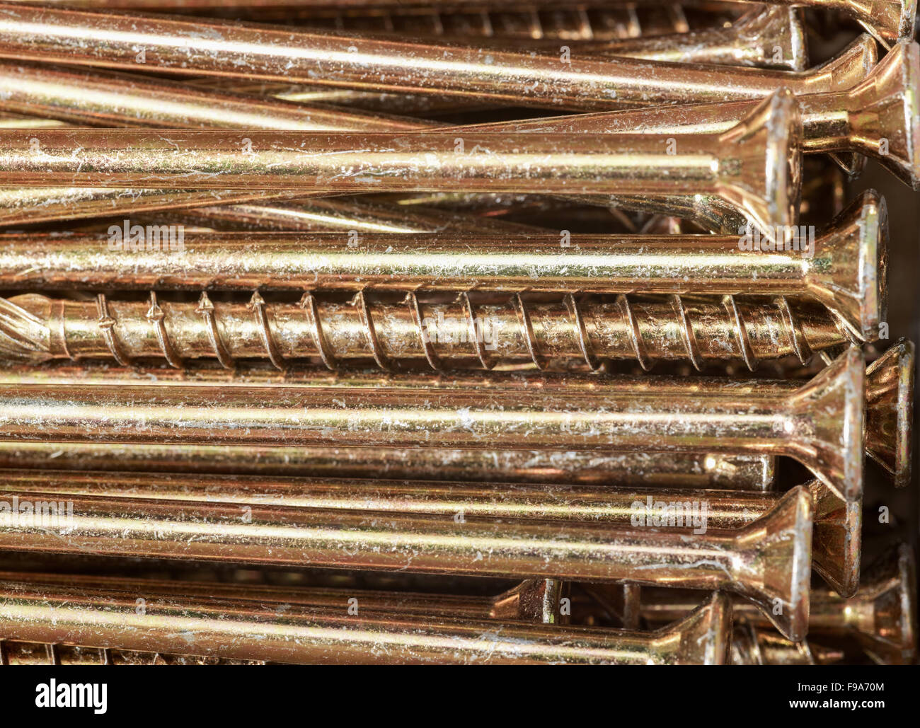 full frame background showing lots of long screws Stock Photo - Alamy