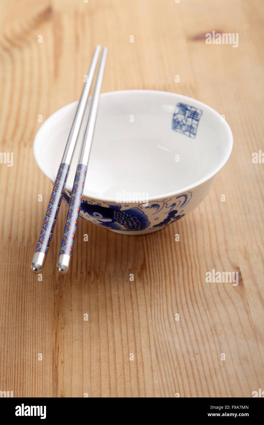 empty chinese rice bowl with chopstick Stock Photo - Alamy