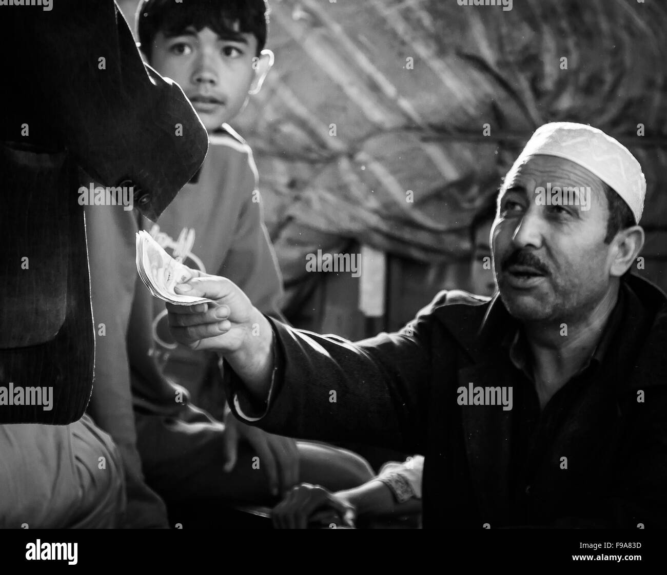 Tenders on the famous animal market in Kashgar. Xinjiang Autonomous ...