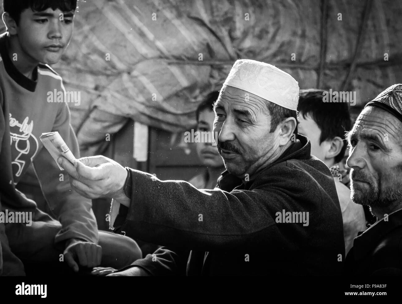 Tenders on the famous animal market in Kashgar. Xinjiang Autonomous ...